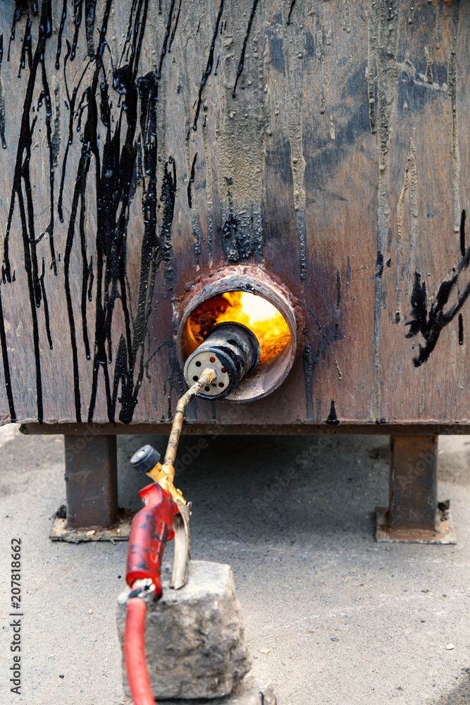 Boiler for melting tar, set up for pitch jointing with molten bitumen ...