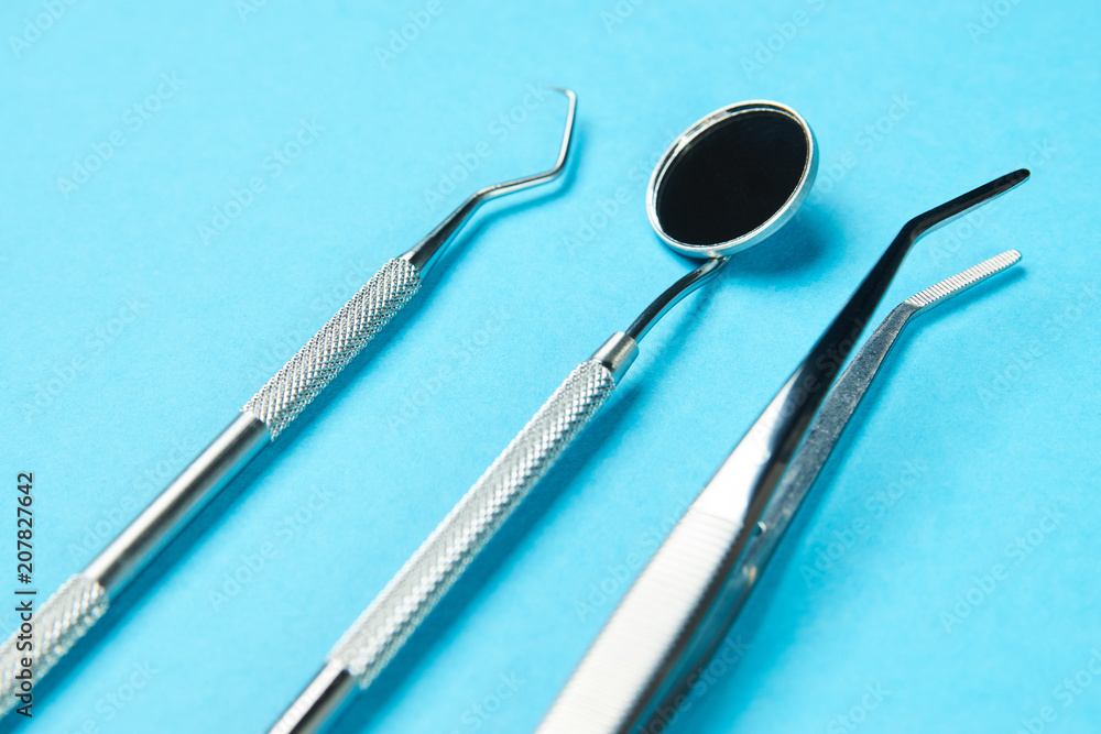 Professional Dentist tools on blue background with copy space. Dentist ...