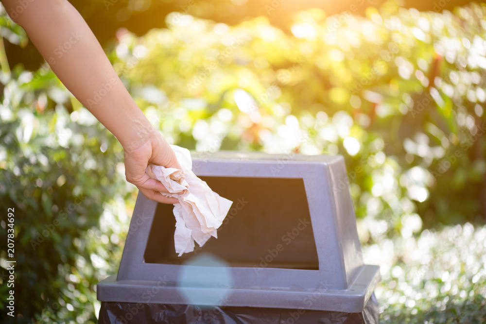 World Environment Day, June 5. Woman hand holding and putting tissue ...