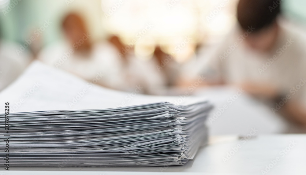 Exam answer sheet or application paper blurry view on table in ...