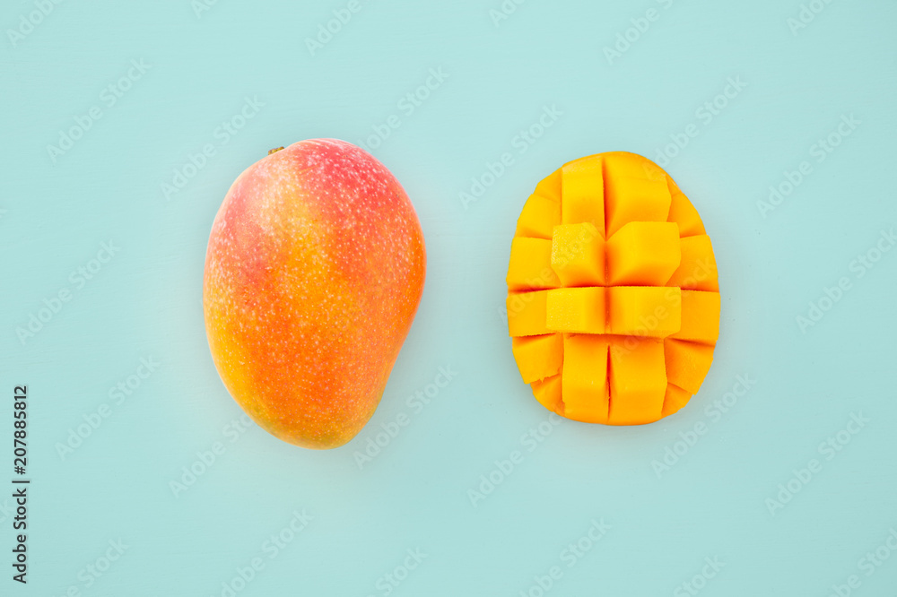 Fresh and beautiful mango fruit with sliced diced mango chunks on a ...
