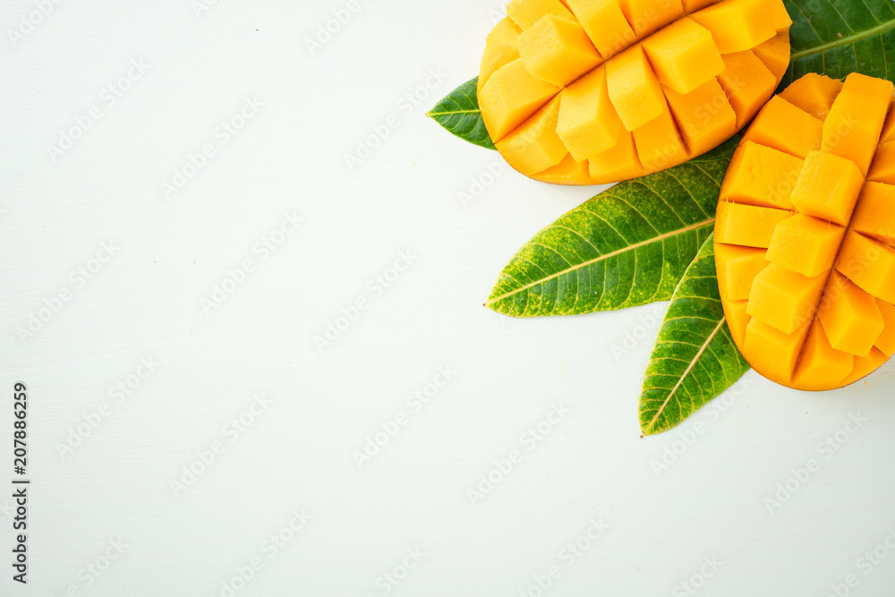 Fresh and beautiful mango fruit with sliced diced mango chunks on a ...