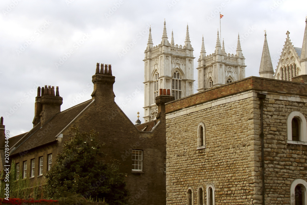 rooftops of London; white turrets of the Gothic cathedral and dark ...