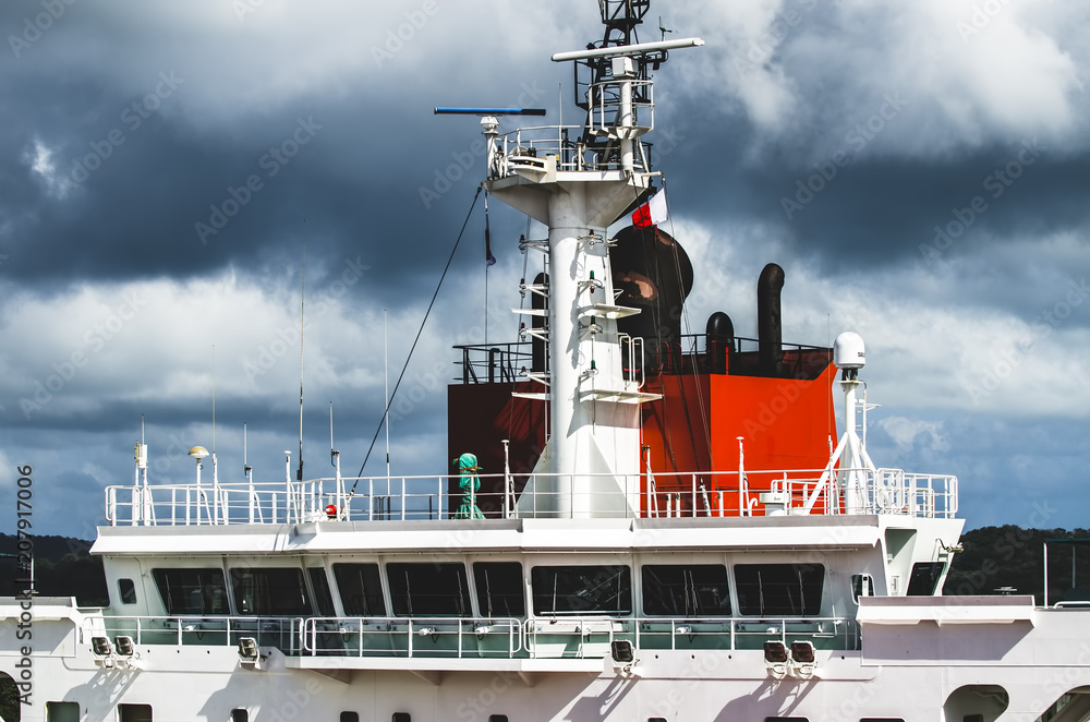 Modern passenger ferry ship. Captains bridge exterior over clear blue ...