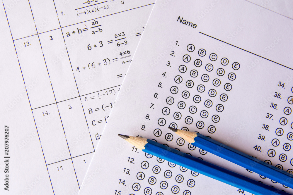 Pencil on answer sheets or Standardized test form with answers bubbled ...