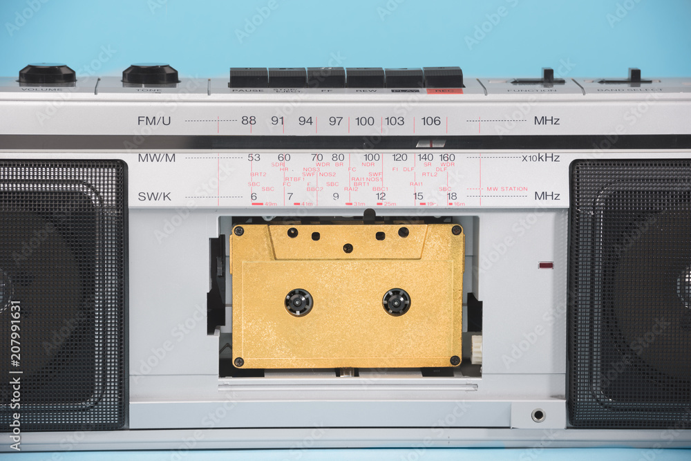 Vintage radio and music player with golden cassette inside Stock Photo ...