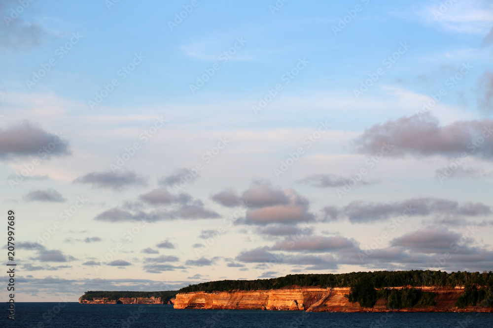 The Sandstone Cliffs Of Pictured Rocks National Lake Shore Glowing ...