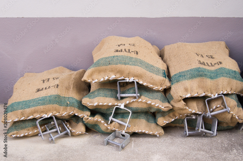 U-type metal in sack. Sack is brown and green. metal using in construct ...