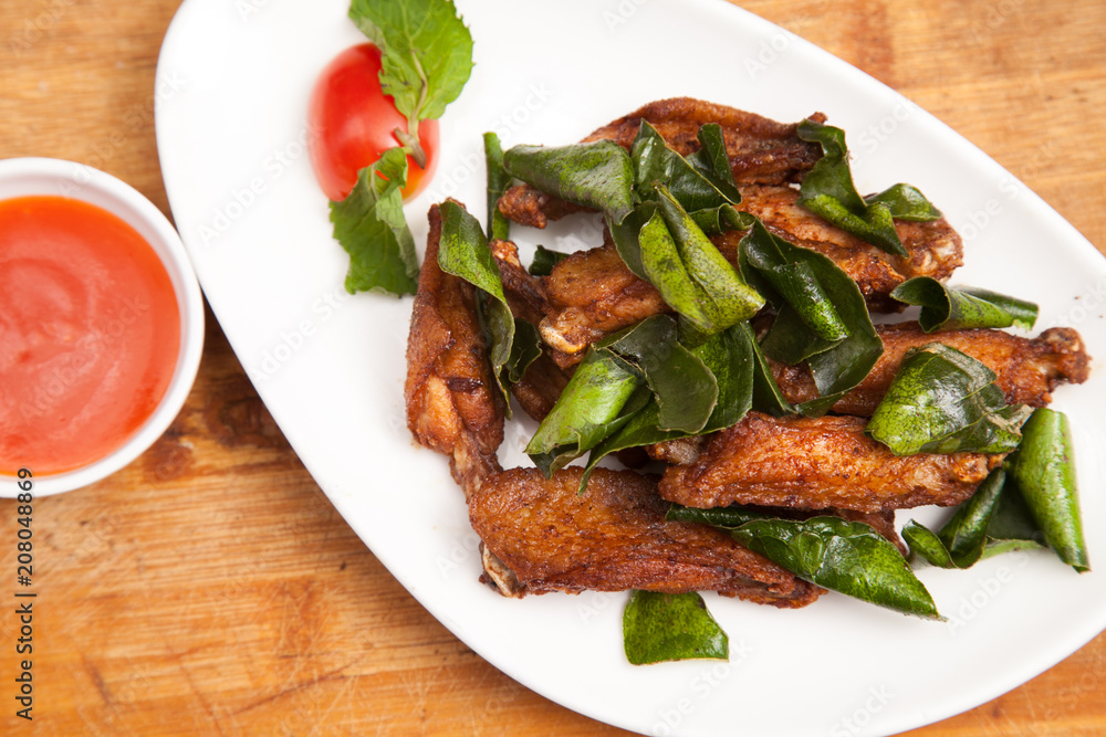 Fried Chicken with Thai Herb Stock Photo | Adobe Stock