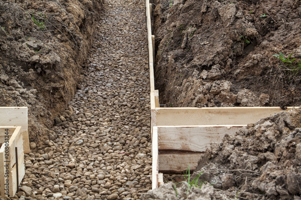 close up view of untreated formwork boards and rubble at the bottom of ...