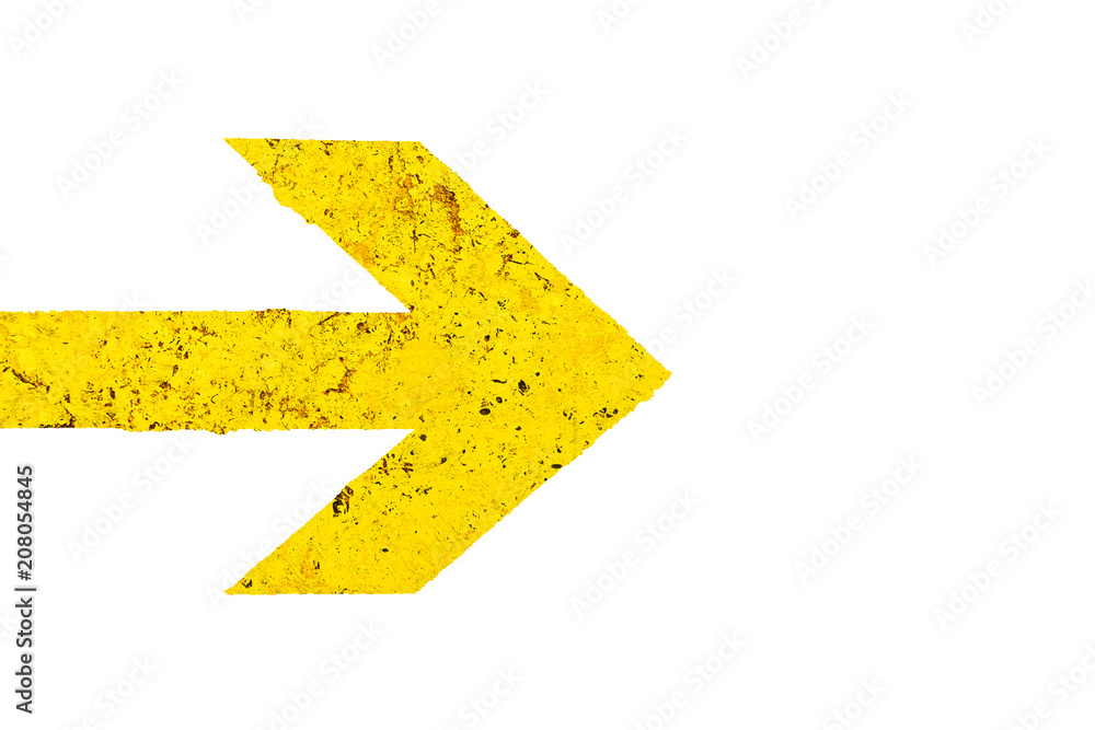 Yellow arrow direction sign with polished stone texture with ...
