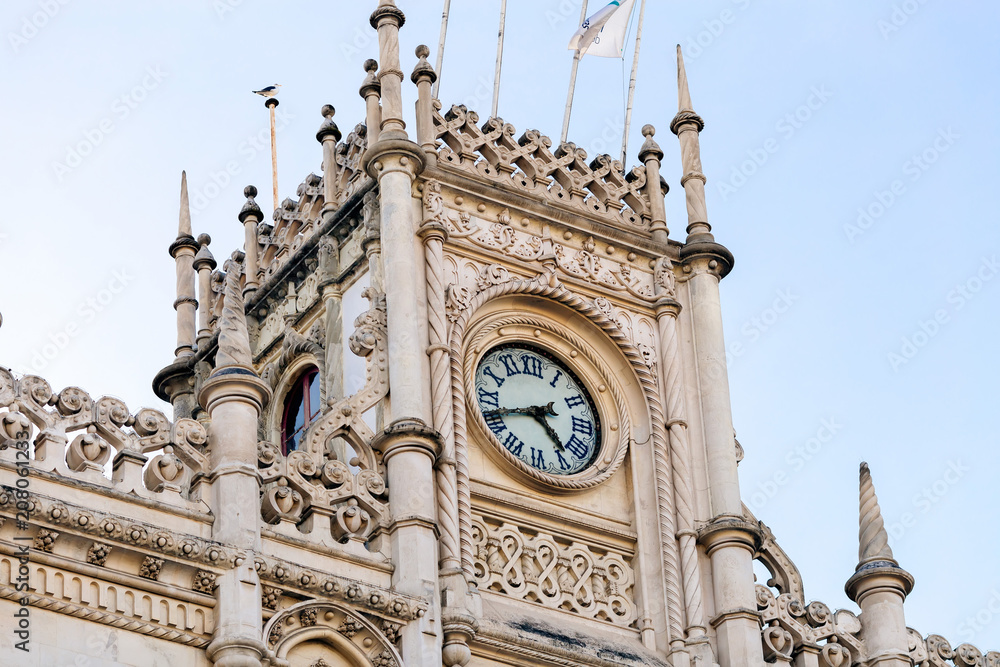 a great round clock that adorns the highest part of the building with ...