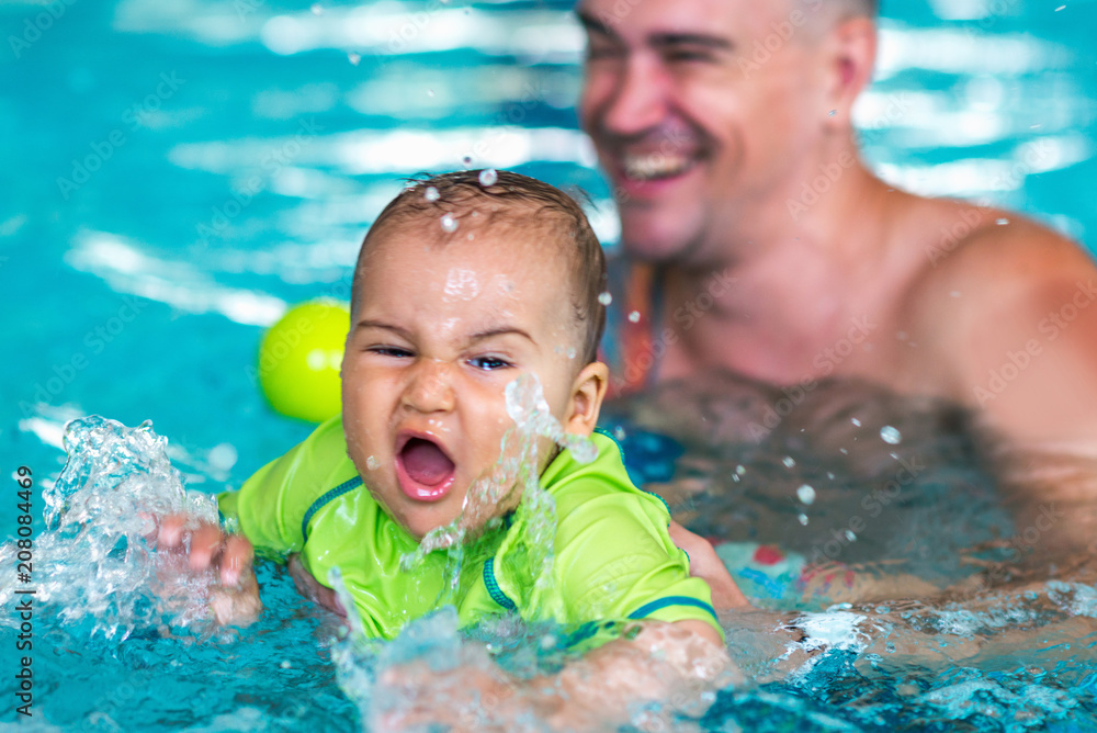 Father with baby boy in the swimming pool on swimming class Stock Photo ...