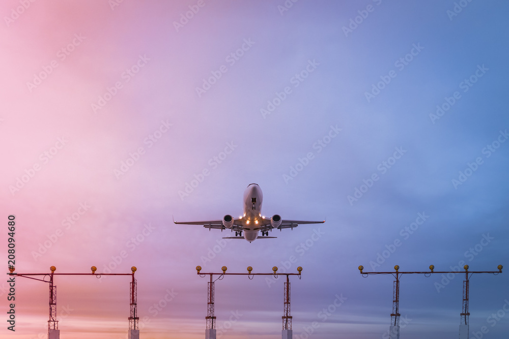 An isolated airliner approaches for landing over visual approach slope ...