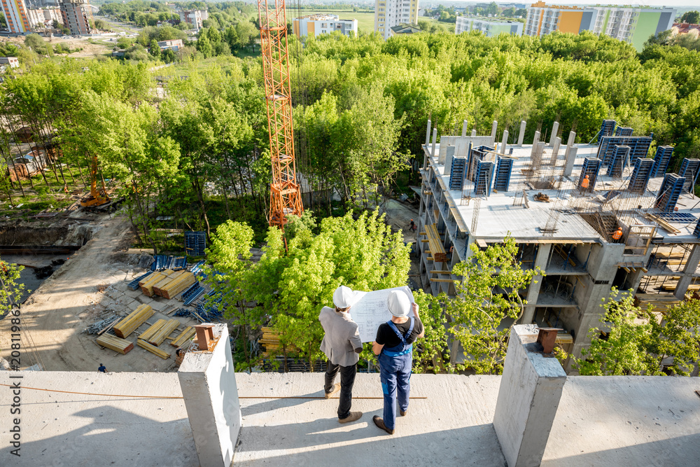 Foto de Top view on the construction site of residential buildings on ...