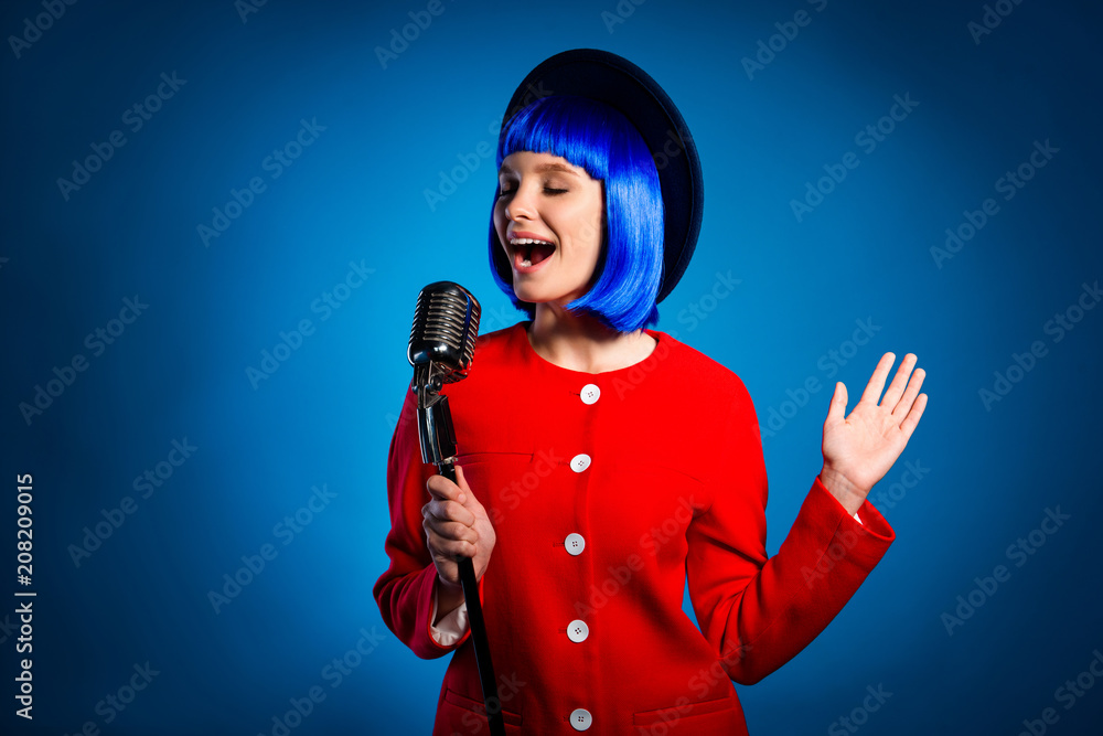 Portrait of creative active artist in headwear red outfit singing with ...