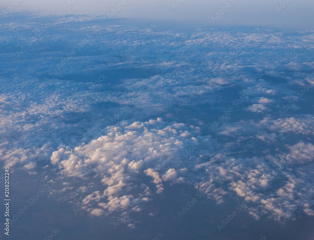 Evening sunset sky from the window of the airplane. View of the ...
