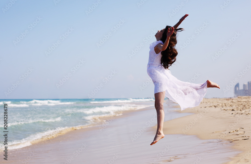 Portrait of aborable 12 years old girl walking alone on the beach in ...