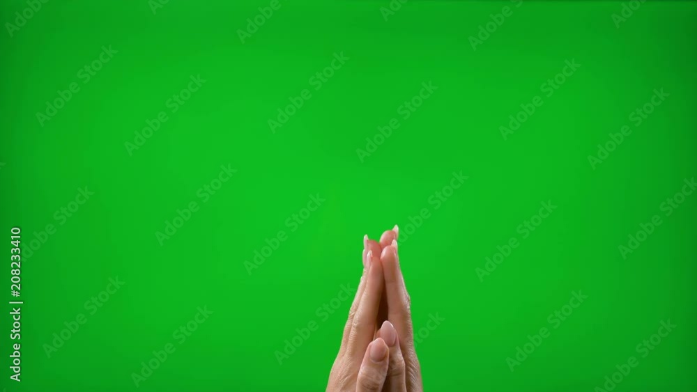 Young business female showing different hand gestures against green ...