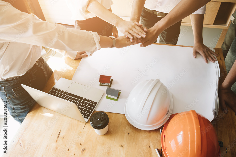 Young colleagues joined together their hands, Support together with ...