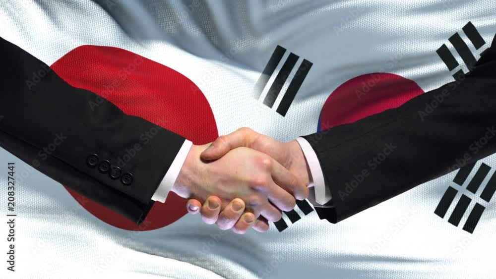 Japan and South Korea handshake international friendship summit, flag ...