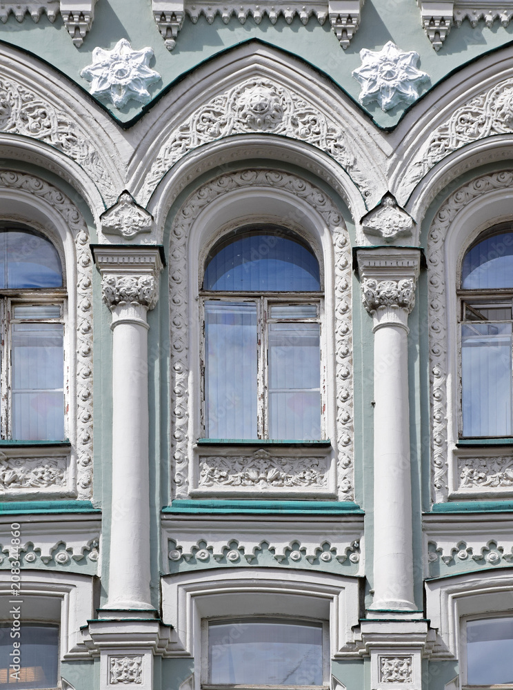 The carved decor of the windows of the apartment house of the Trinity ...