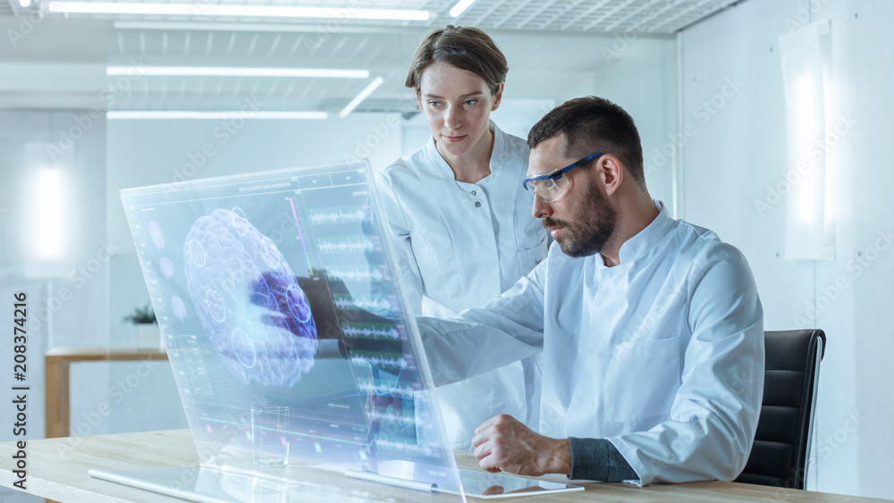 In the Futuristic Laboratory Male and Female Scientists Talk While ...