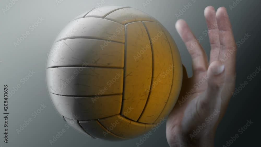 A closeup of a volleyball ball caught in ultra motion flying through ...