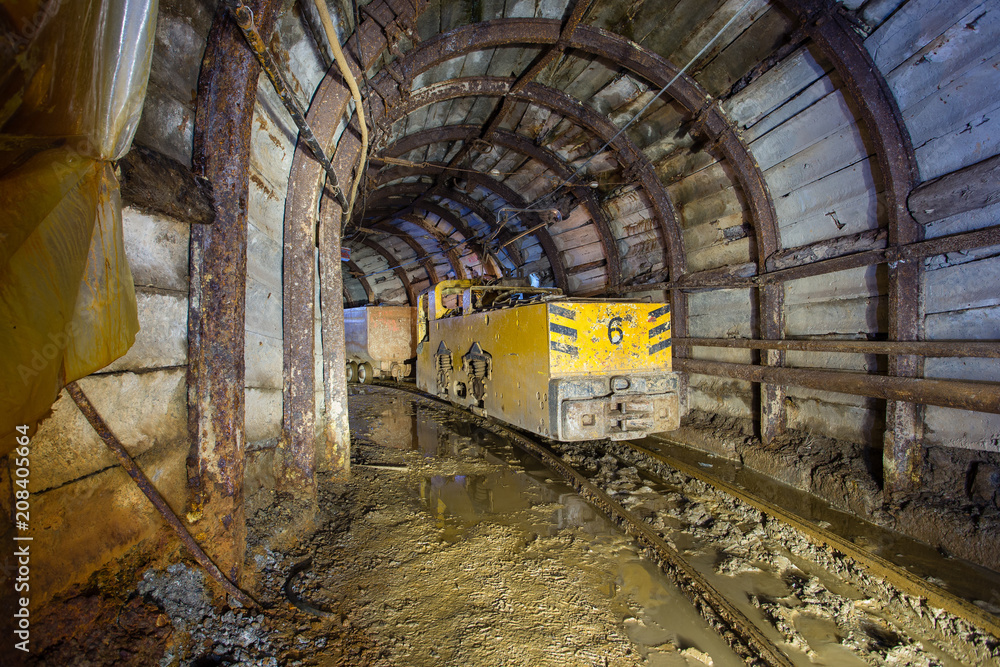 Underground emerald ore mine shaft tunnel gallery with electrical ...
