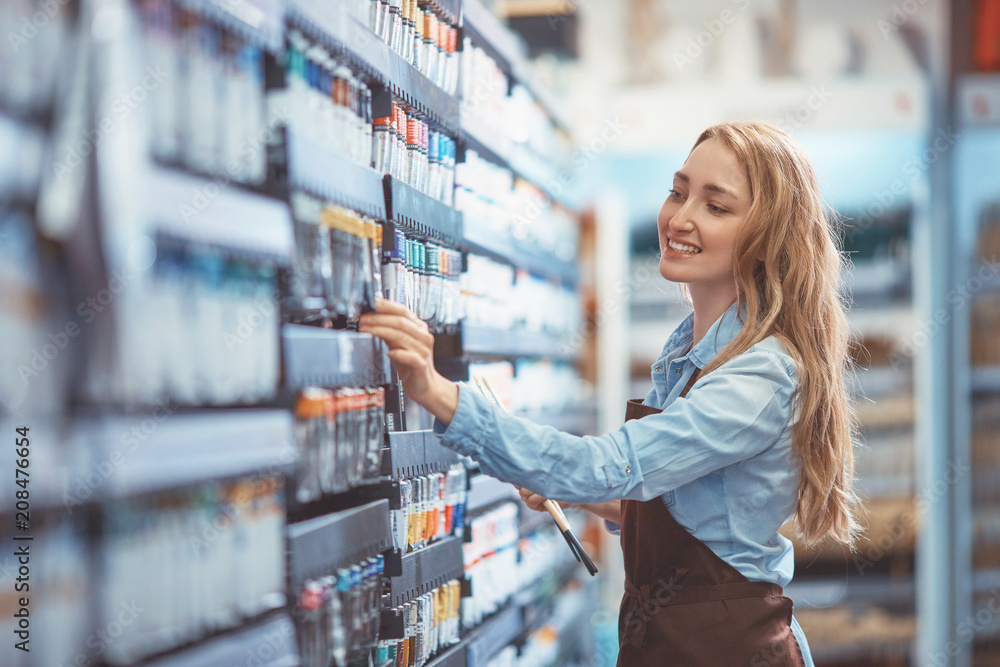Young artist in an art shop Stock Photo | Adobe Stock