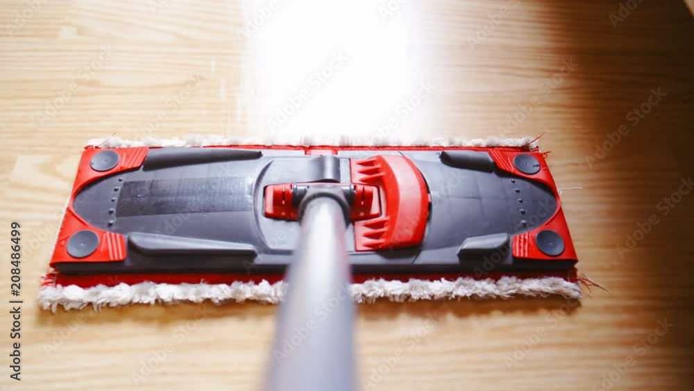 Microfiber Dust Wet Mop move around the floor close-up 4K. Top view POV of mop in focus cleaning ...