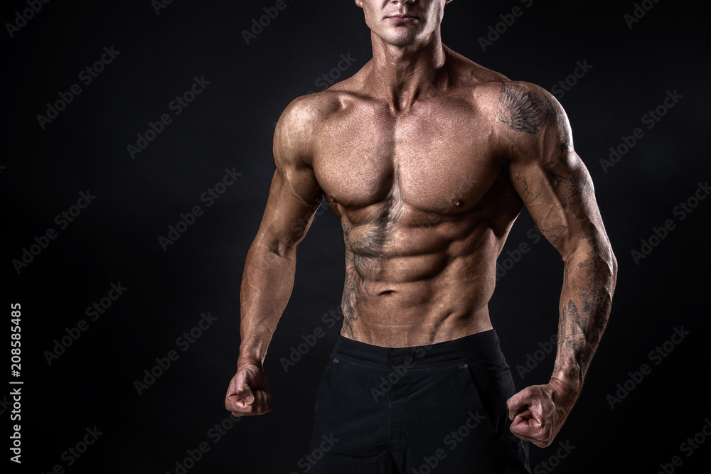Unrecognizable Strong bodybuilder with six pack. Bodybuilder man with ...