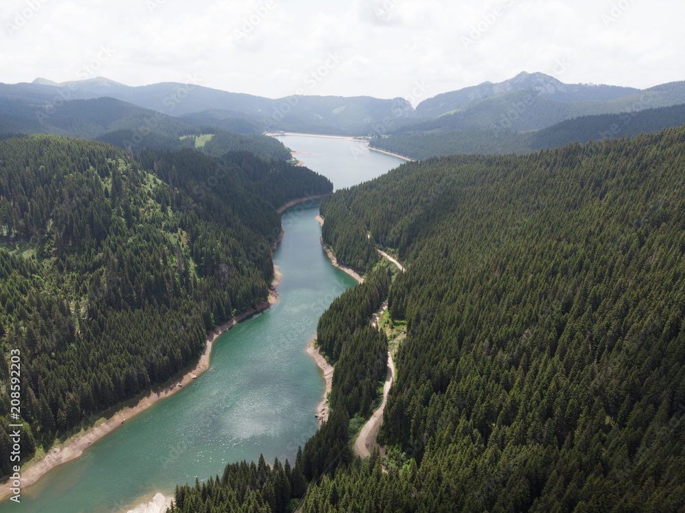 Beautiful turquoise waters of the mountain lake. Vibrant Blue Lake in ...