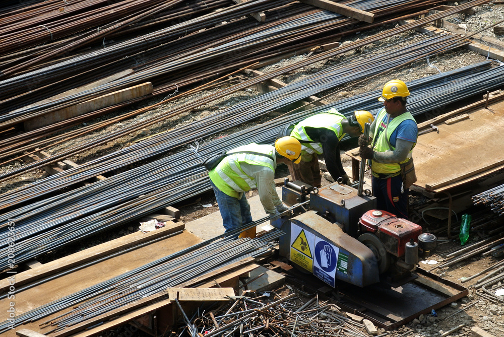 Fotka „Construction workers working at the steel reinforcement bar ...