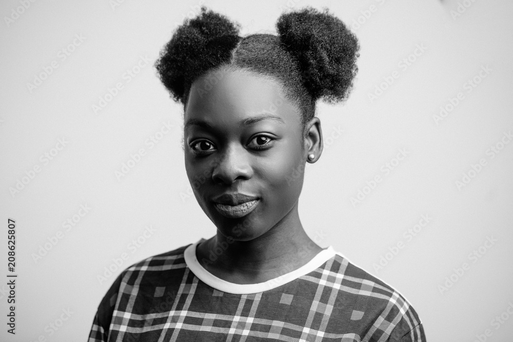 portrait of good-looking African woman with hair knots. hairstyle like ...