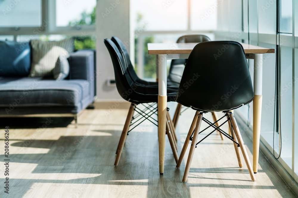 modern wooden table with dining chair near big window office background ...