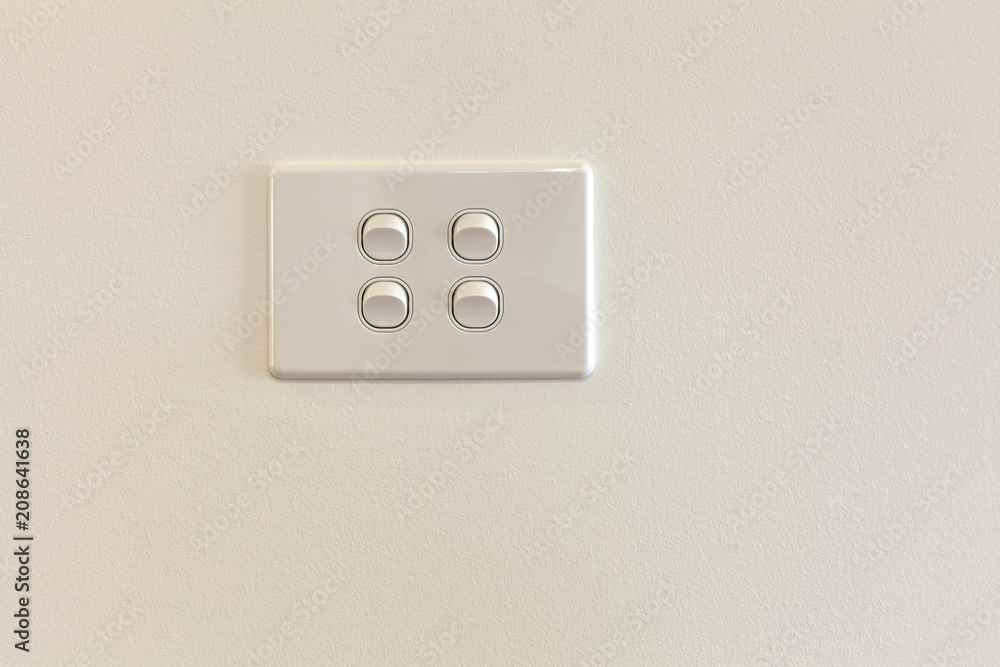 Quad modern light switch on white wall with copy space Stock Photo ...