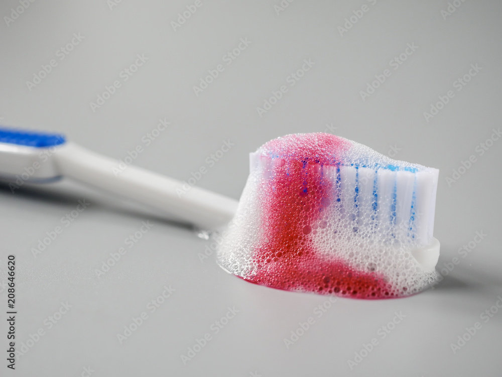Blood and toothpaste on the toothbrush. Scurvy concept. Stock Photo ...