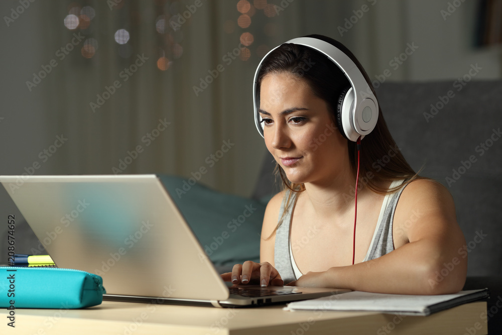 Student elearning watching online tutorials in the night Stock Photo ...