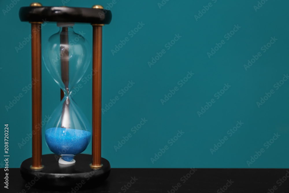 Hourglass on color background. Time management concept Stock Photo ...