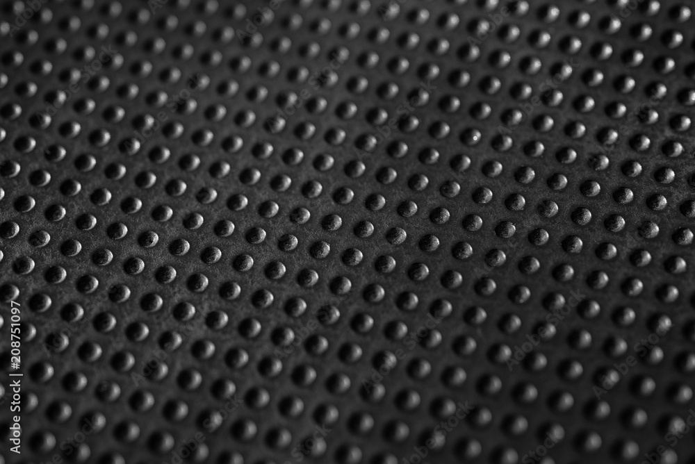 Black dotted texturised technological seamless fabric or surface ...