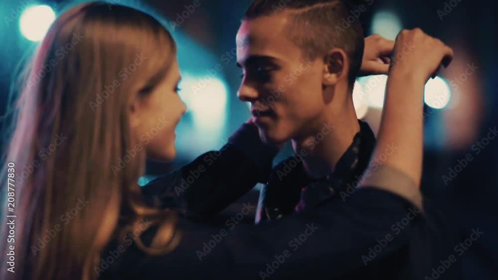 Rotation view of hot couple, embracing and passionately kissing at ...