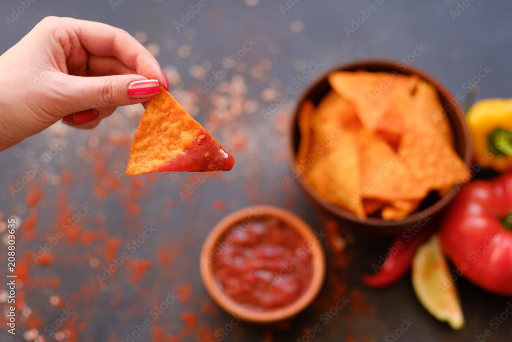 tortilla nacho chips recipe. natural fried crisps in a bowl. woman hand ...