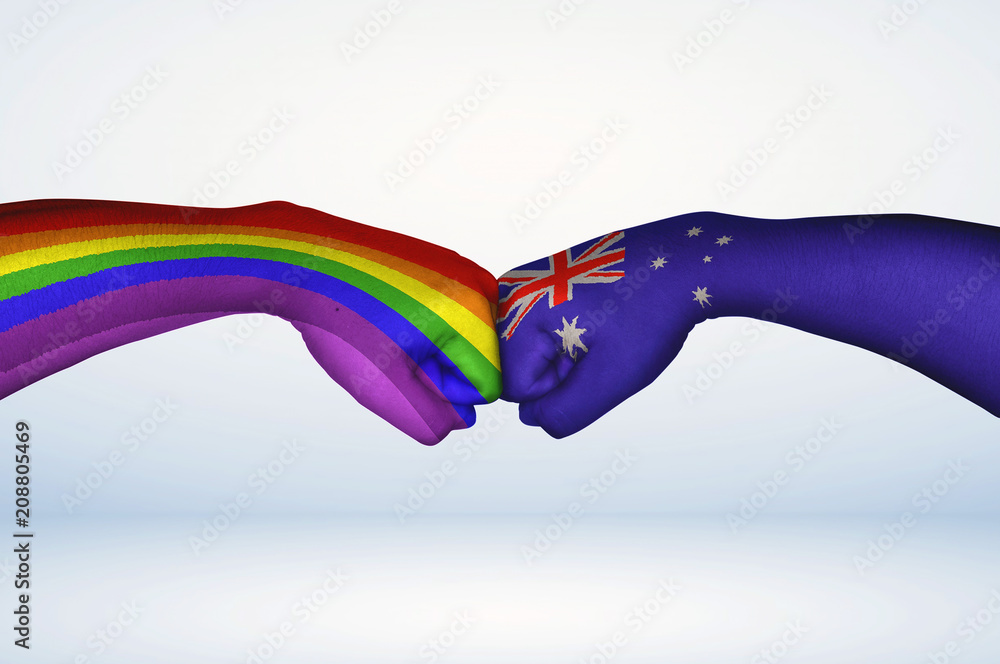 Fist bump of Australian and Pride Flags Two hands with painted flags of ...