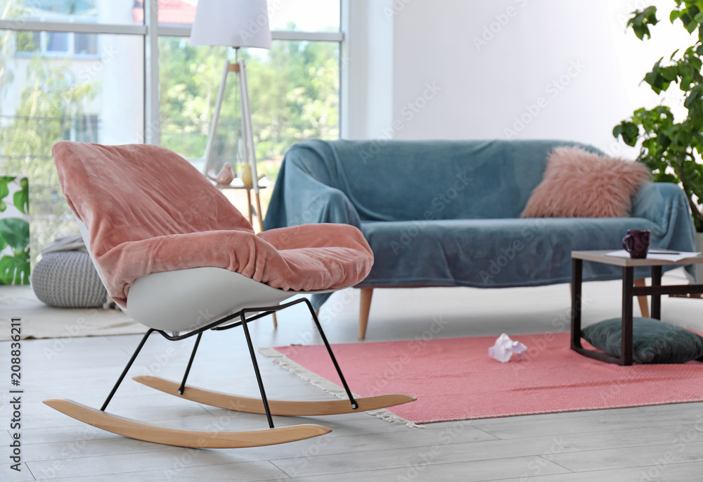 Elegant living room interior with rocking chair and cozy sofa Stock ...