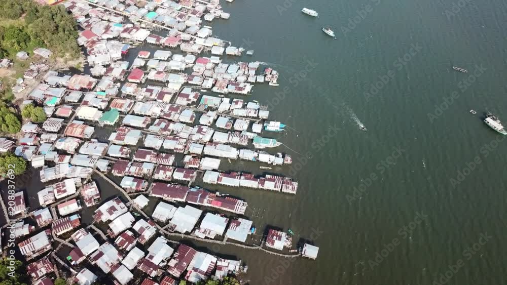 Water village. Poor coastal fishing village in Asia. Poverty, slum ...