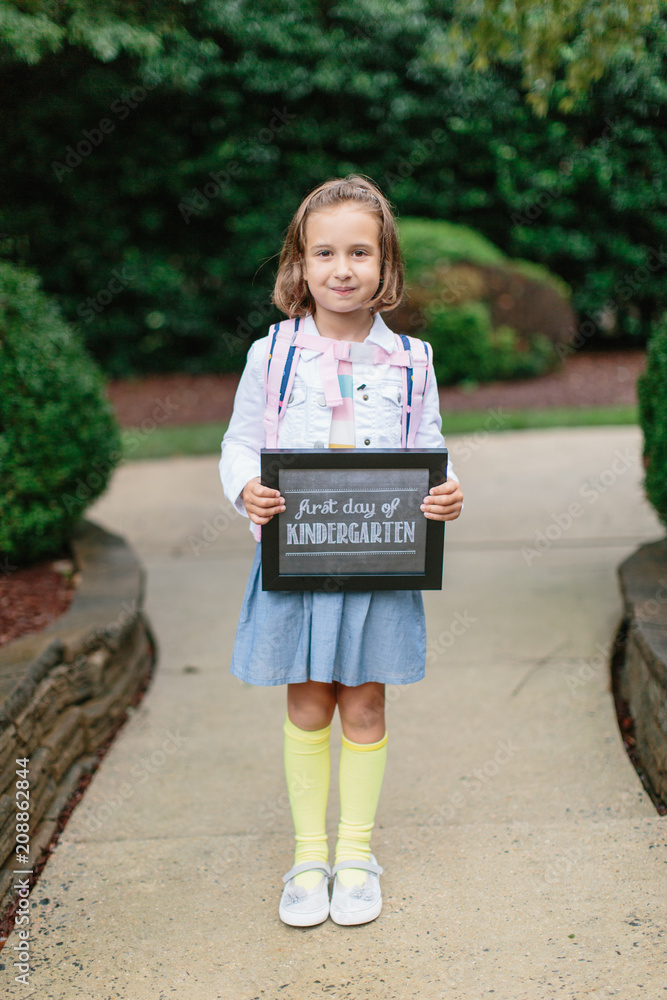 Cute young girl ready for her first day of kindergarten Stock Photo ...
