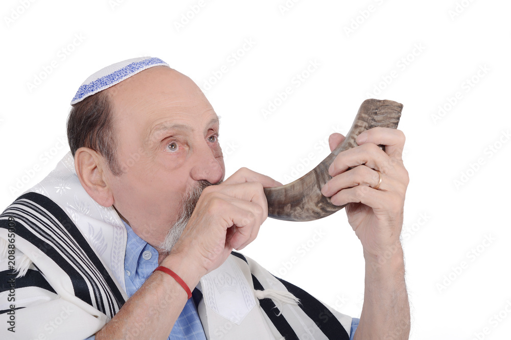 Eldery jewish man blowing the Shofar horn for Rosh Hashanah Stock Photo ...