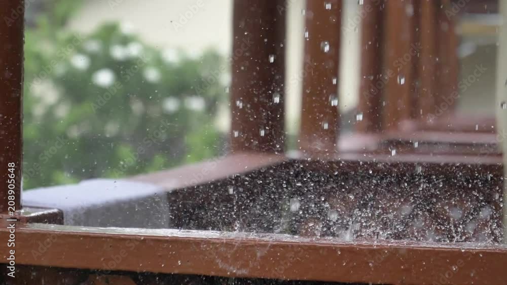 Video „CLOSE UP, DOF: Monsoon rain washes the brown metal railing on ...