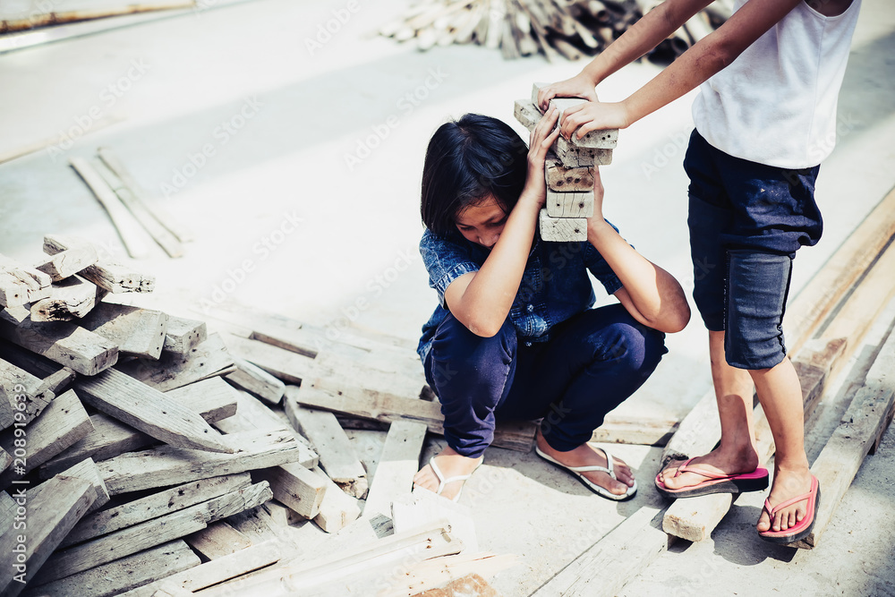 Two little girl labor working in commercial building structure, World ...